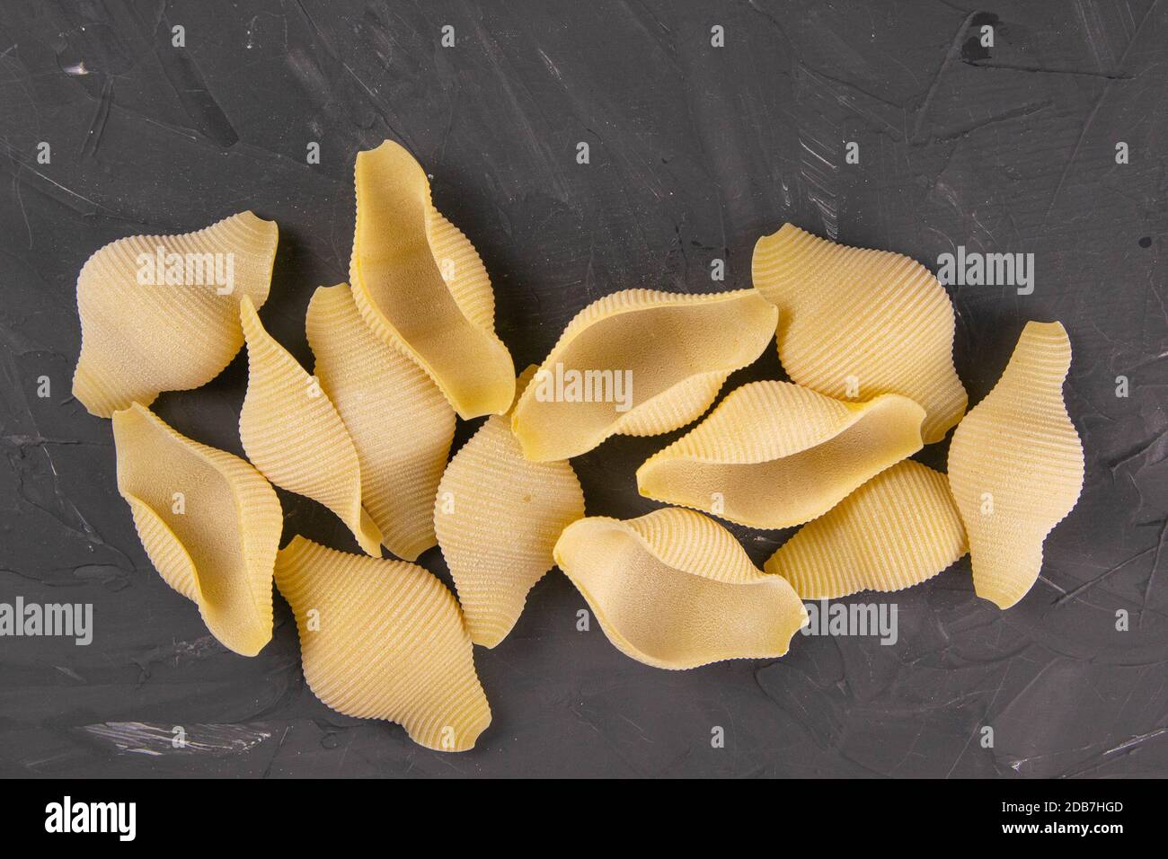 Conchiglie pasta shell composition on black background with clipping ...