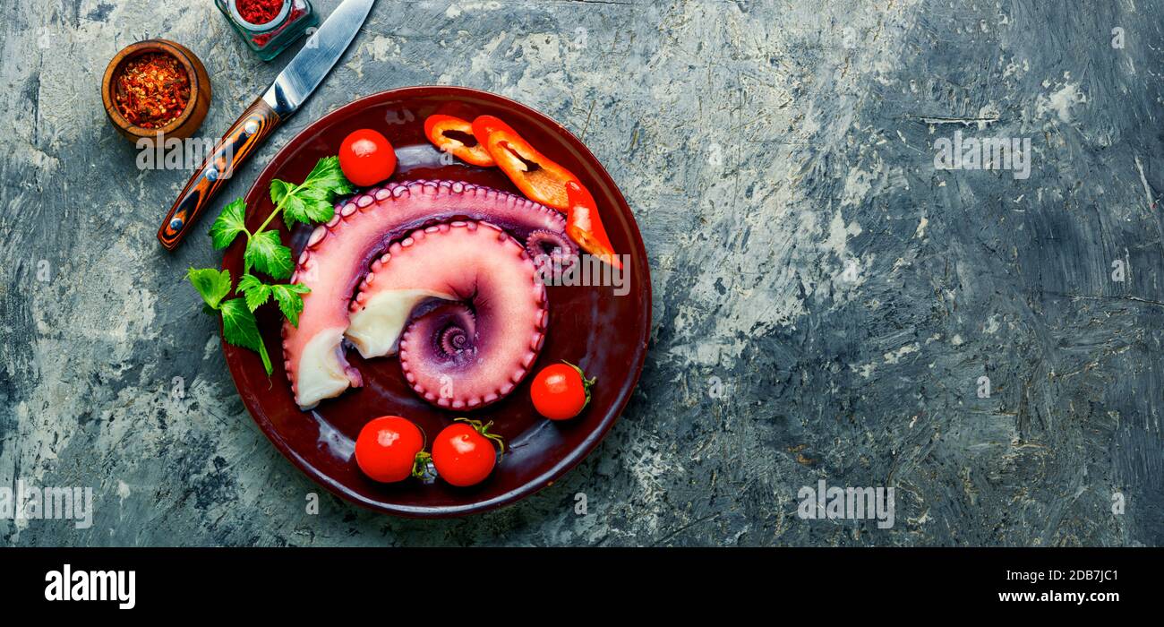 Tentacles of raw octopus.Seafood.Raw octopus ready for cooking.Flat lay ...