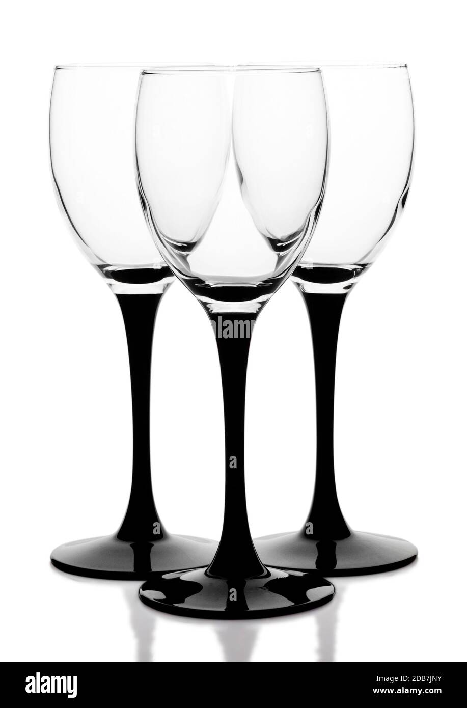 three glasses on the black-legged on a white background Stock Photo - Alamy