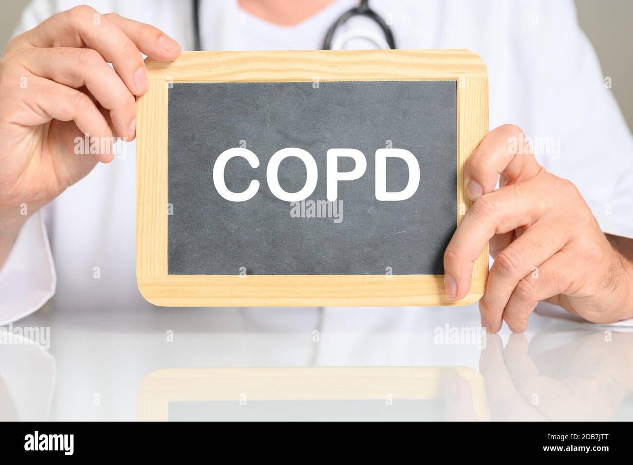 A doctor holding a board with COPD word on it Stock Photo - Alamy