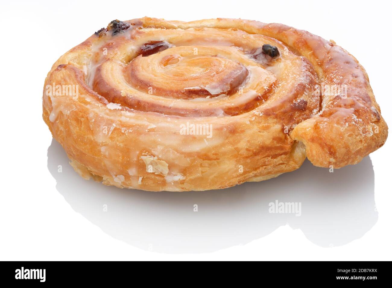 Sugar snail with raisins and icing white isolated Stock Photo - Alamy