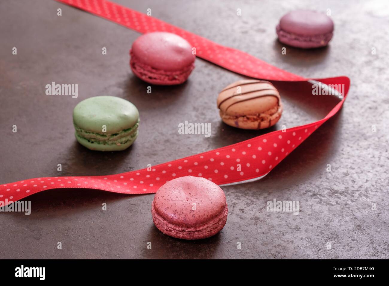 Macaron on a griddle with red ribbon Stock Photo - Alamy
