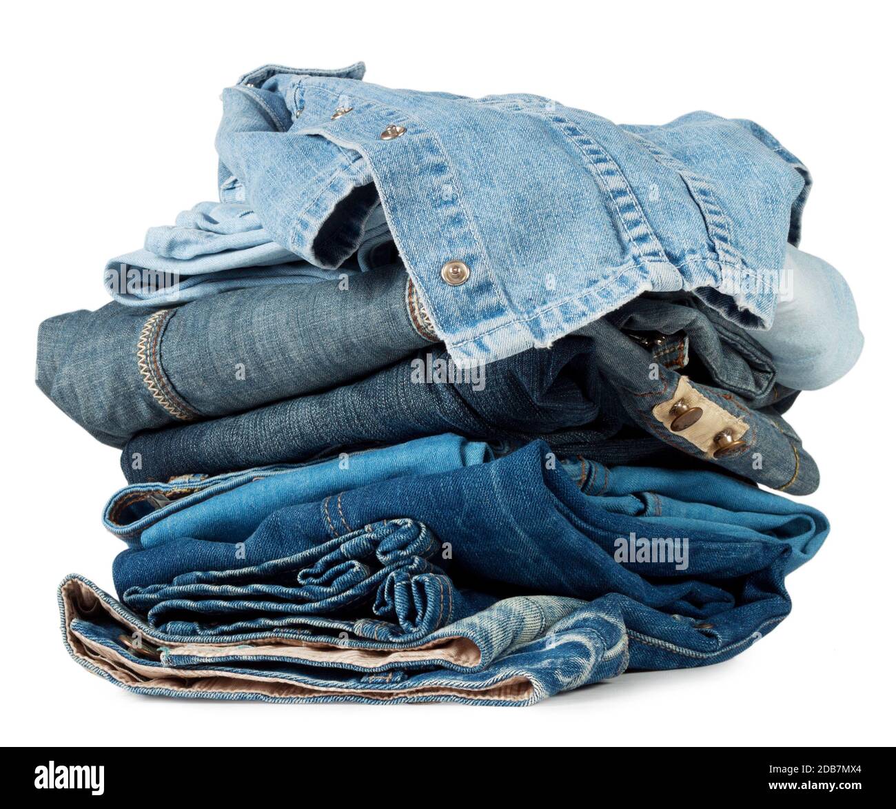 A large stack of colored denim products isolated on white background ...