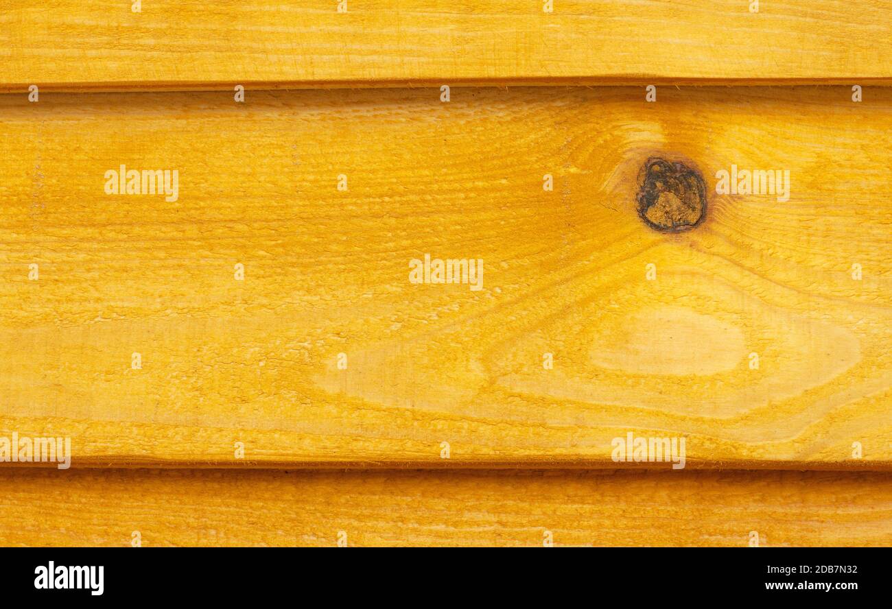 Background of rough planed planks painted in yellow Stock Photo - Alamy