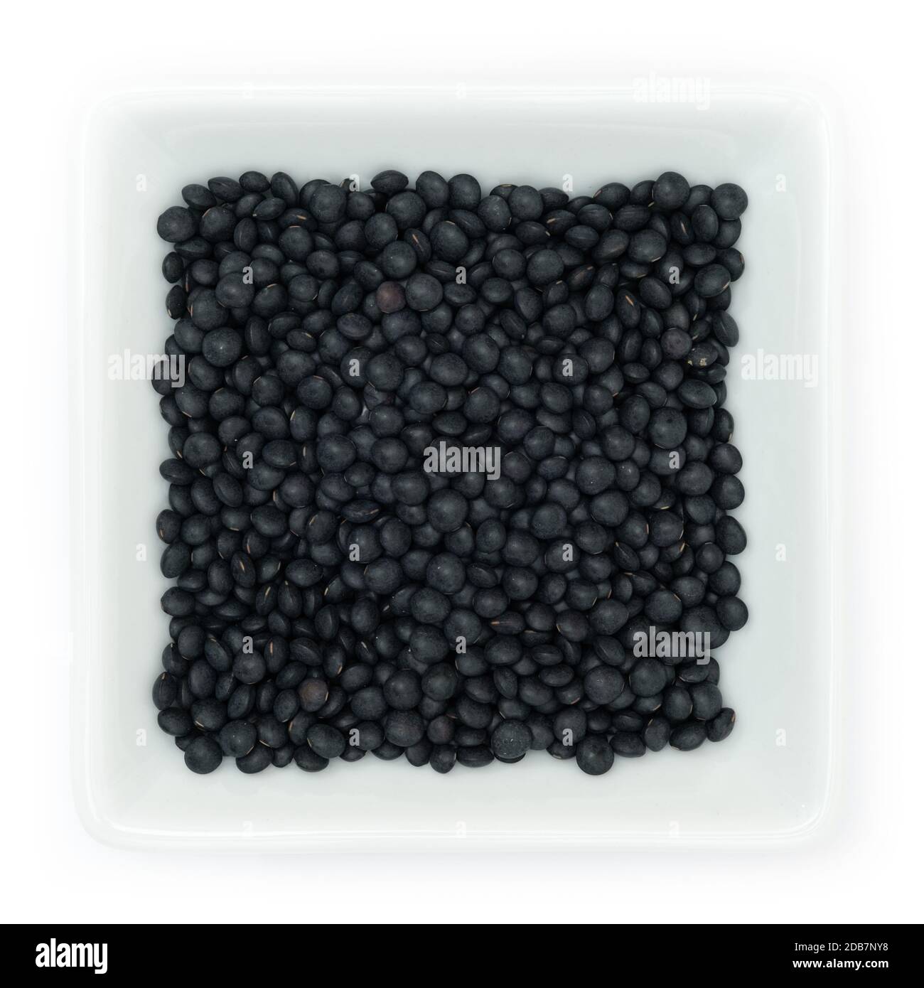 Raw black beluga lentlis in white bowl in top view Stock Photo - Alamy