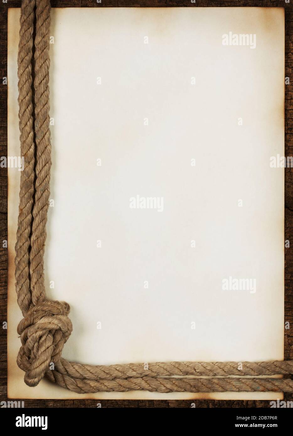Sheet of old paper with rope on a wooden background Stock Photo - Alamy