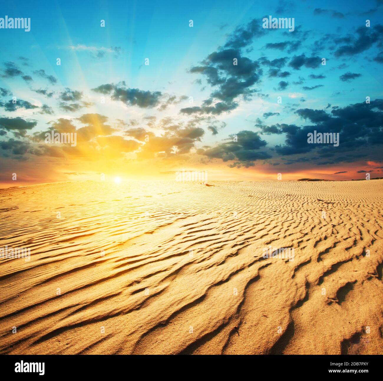 Red sunset in a desert with dunes Stock Photo - Alamy