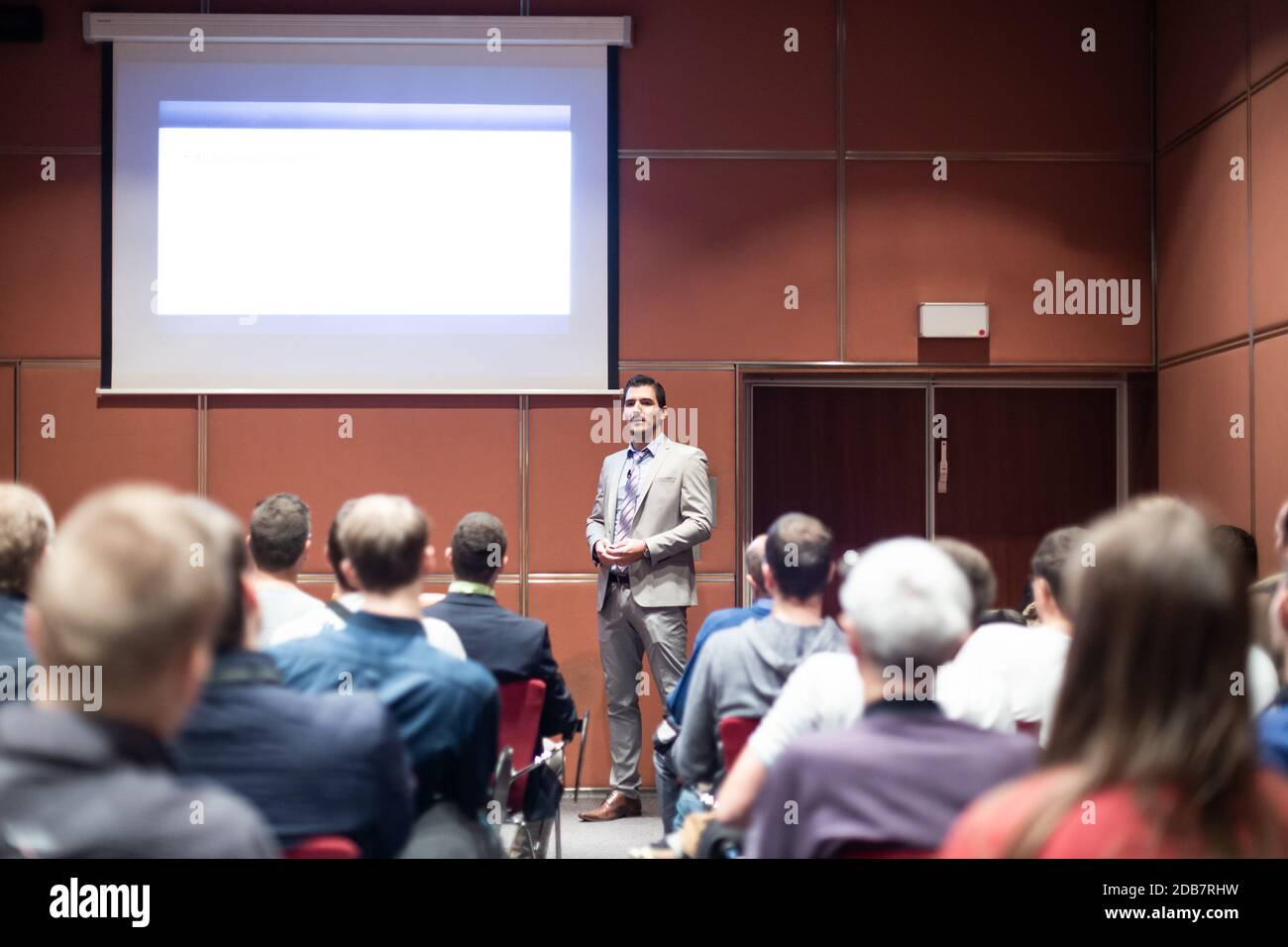 Speaker giving a talk in conference hall at business meeting event ...