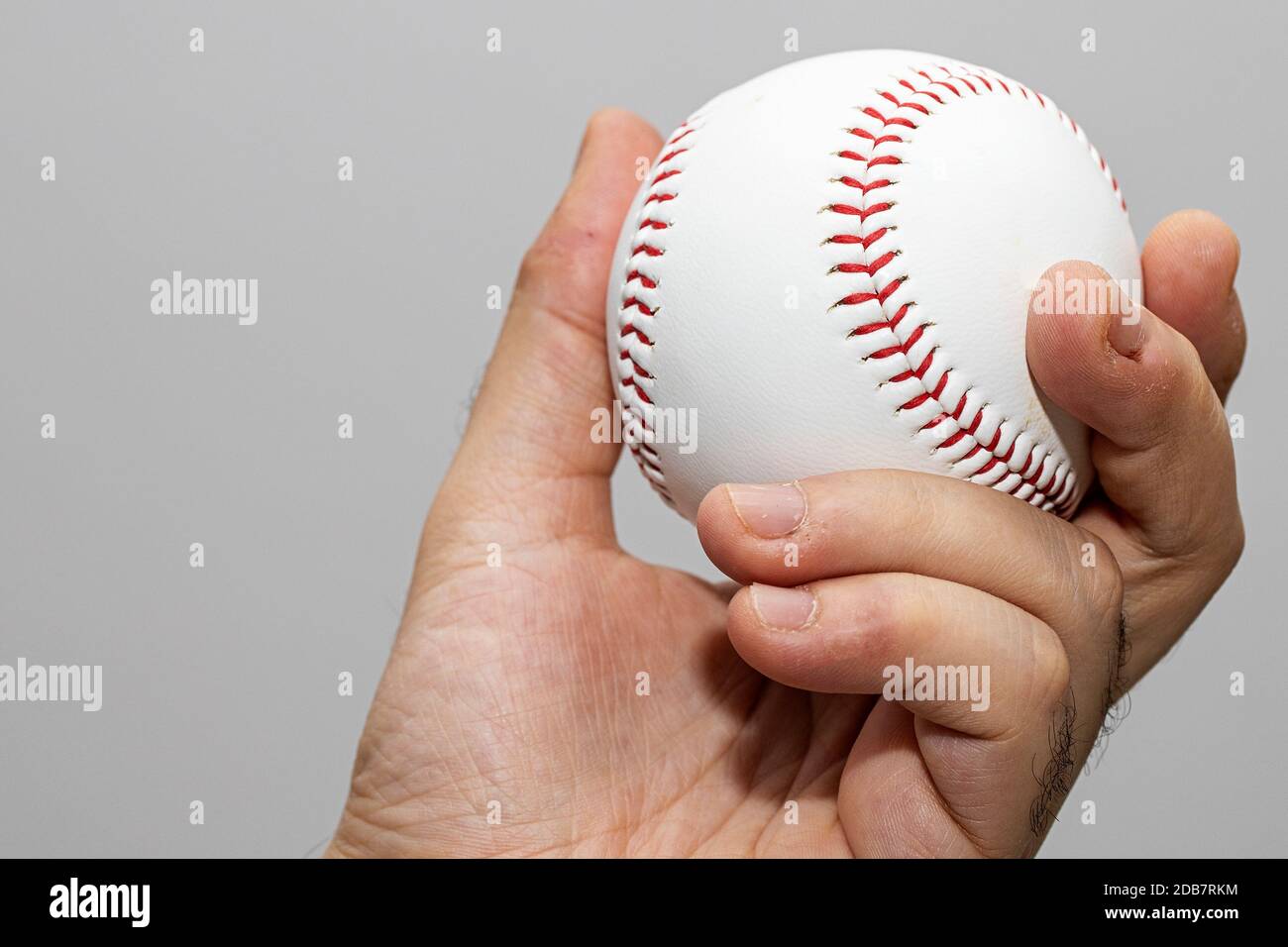 baseball ball white sport hand holding game Stock Photo - Alamy