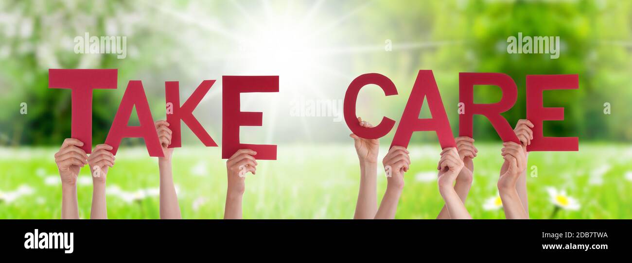 People Hands Holding Colorful English Word Take Care. Sunny Green Grass ...