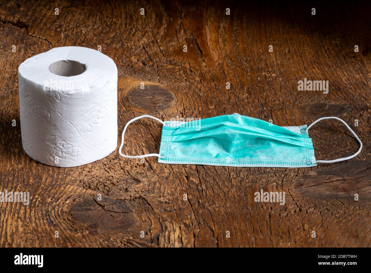 toilet paper and medical mask Stock Photo - Alamy