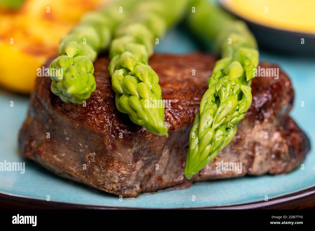 asparagus with potatoes and a steak Stock Photo - Alamy