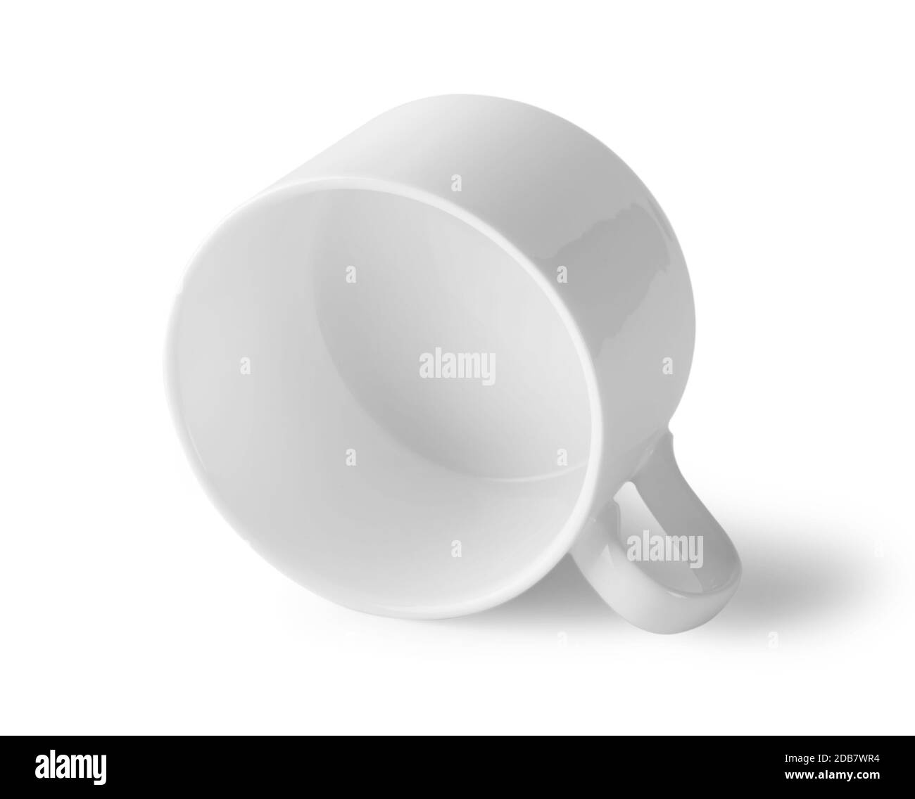 Cup lying on its side isolated on white background Stock Photo - Alamy