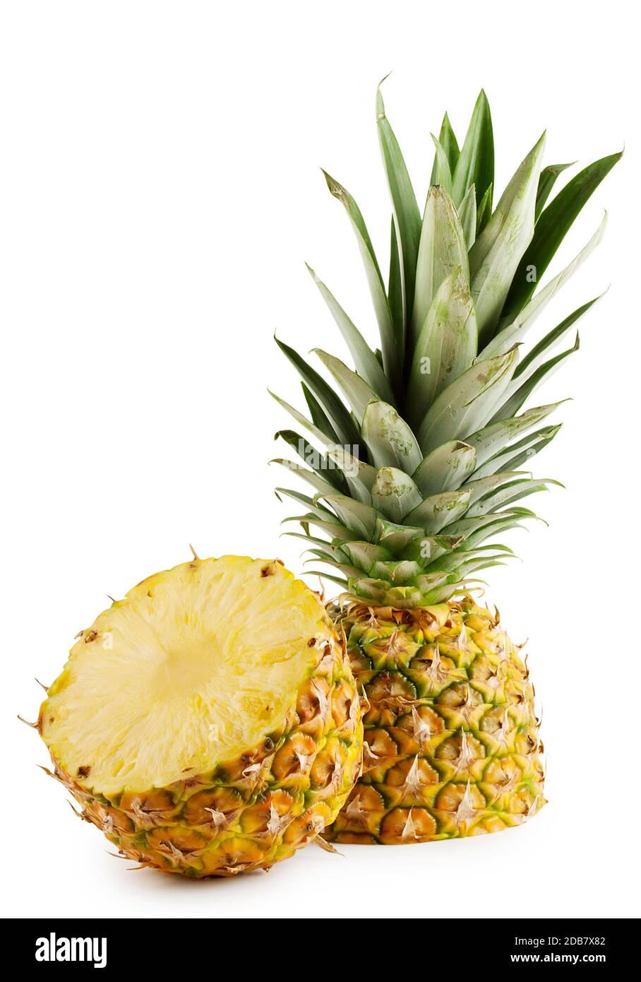 Pineapple cut in half isolated on a white background Stock Photo - Alamy