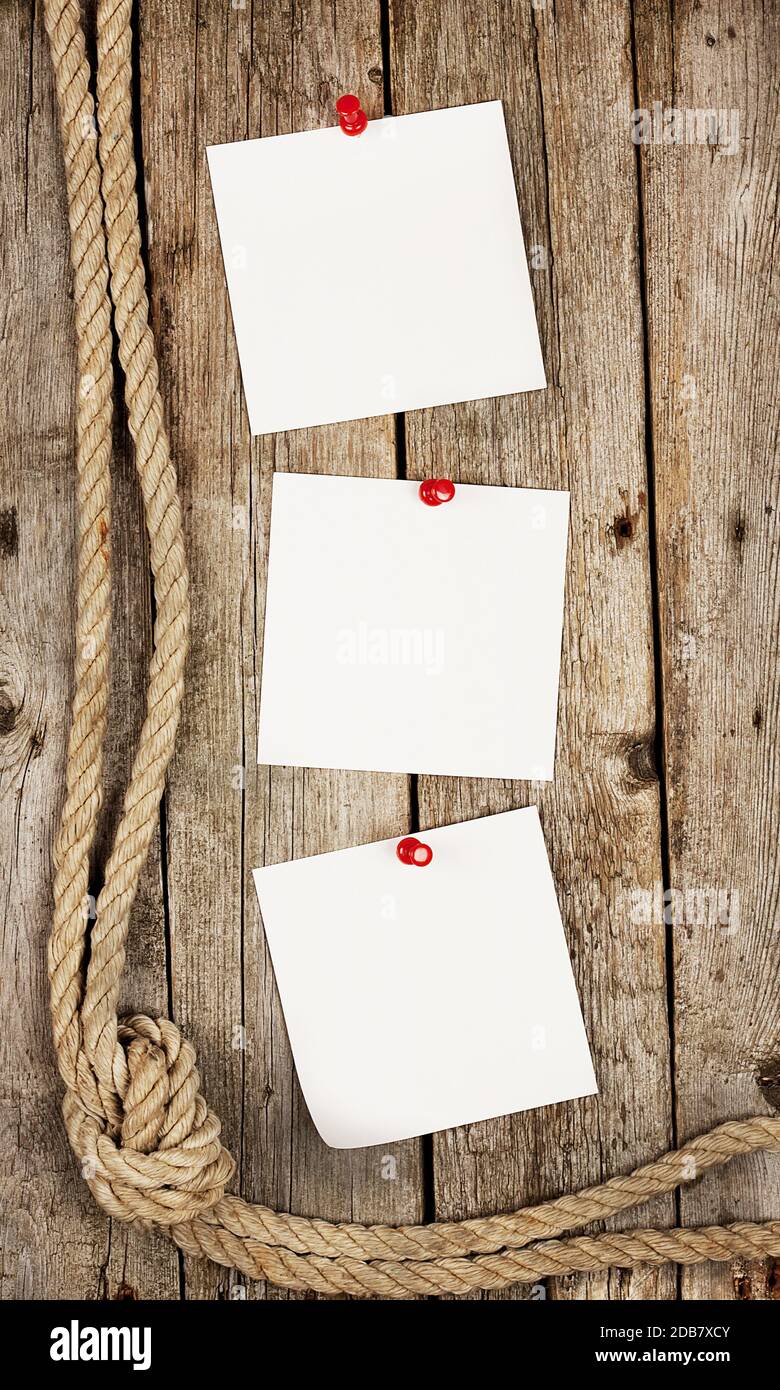 White stickers on wooden background with rope Stock Photo - Alamy