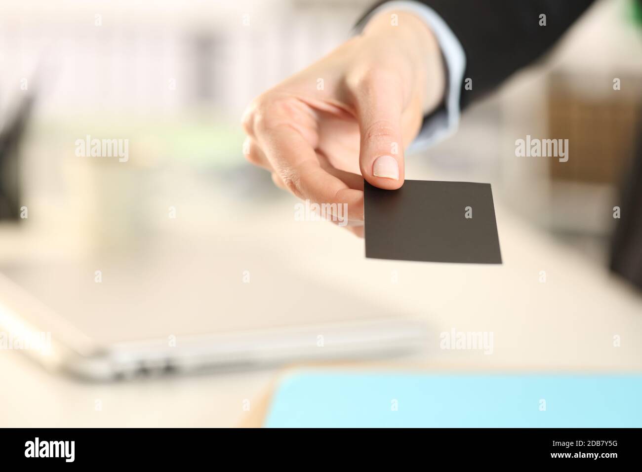 Close up of business woman hand giving business card at the office ...