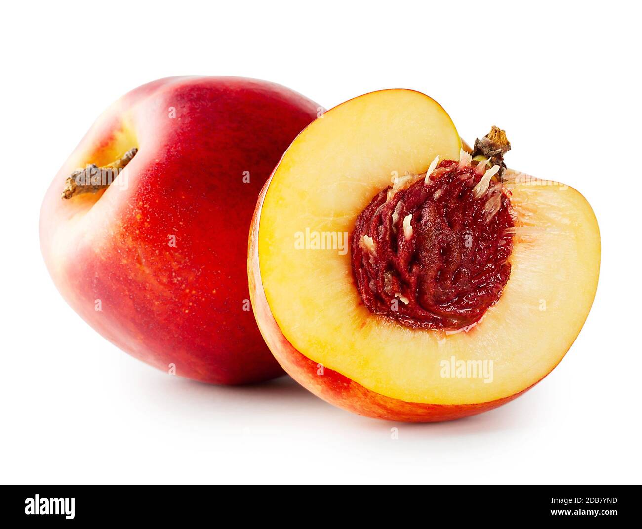 Cut juicy nectarine with bone isolated on a white background Stock ...