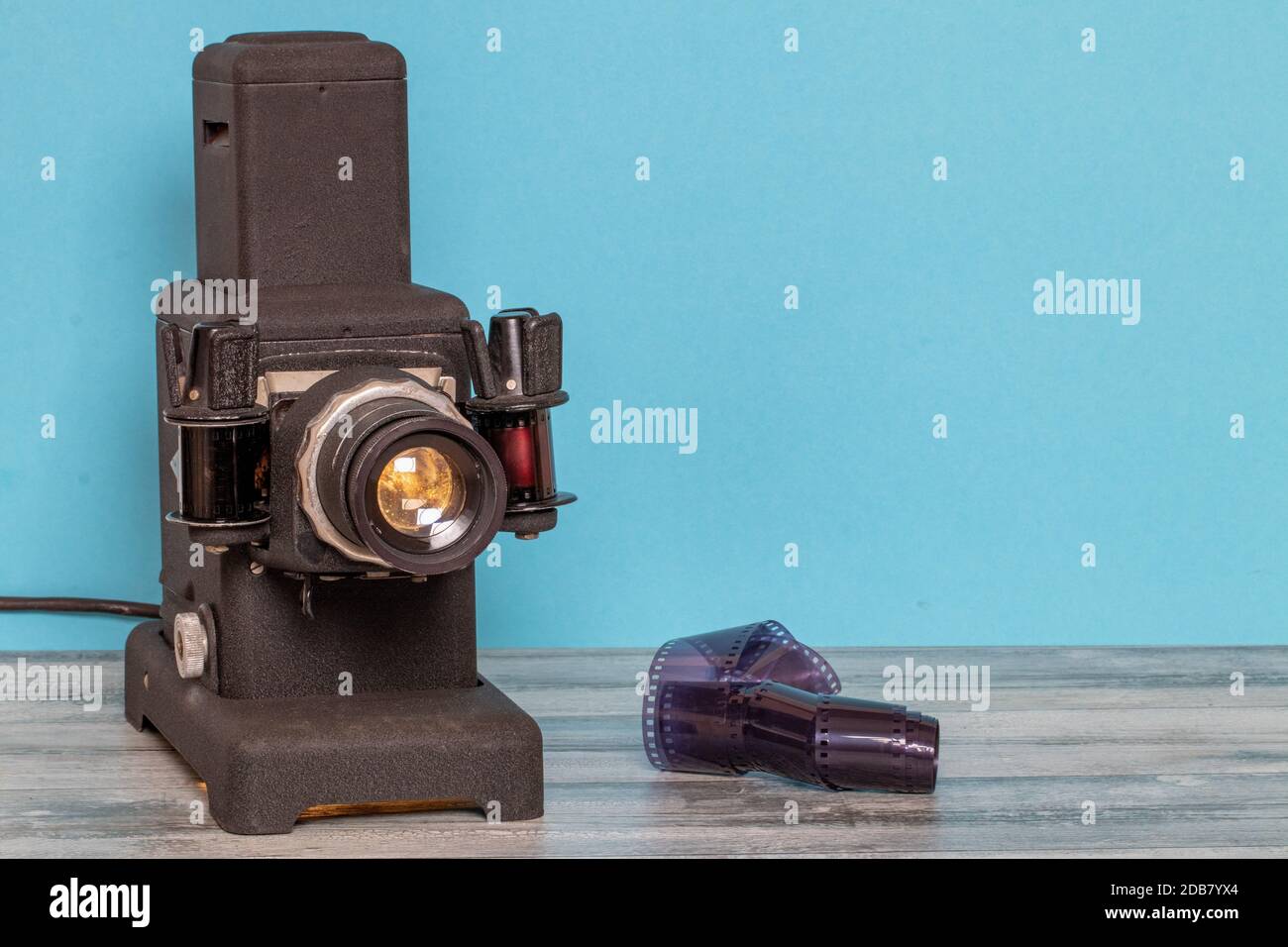 Close-up of a running old black projector for viewing slides and ...