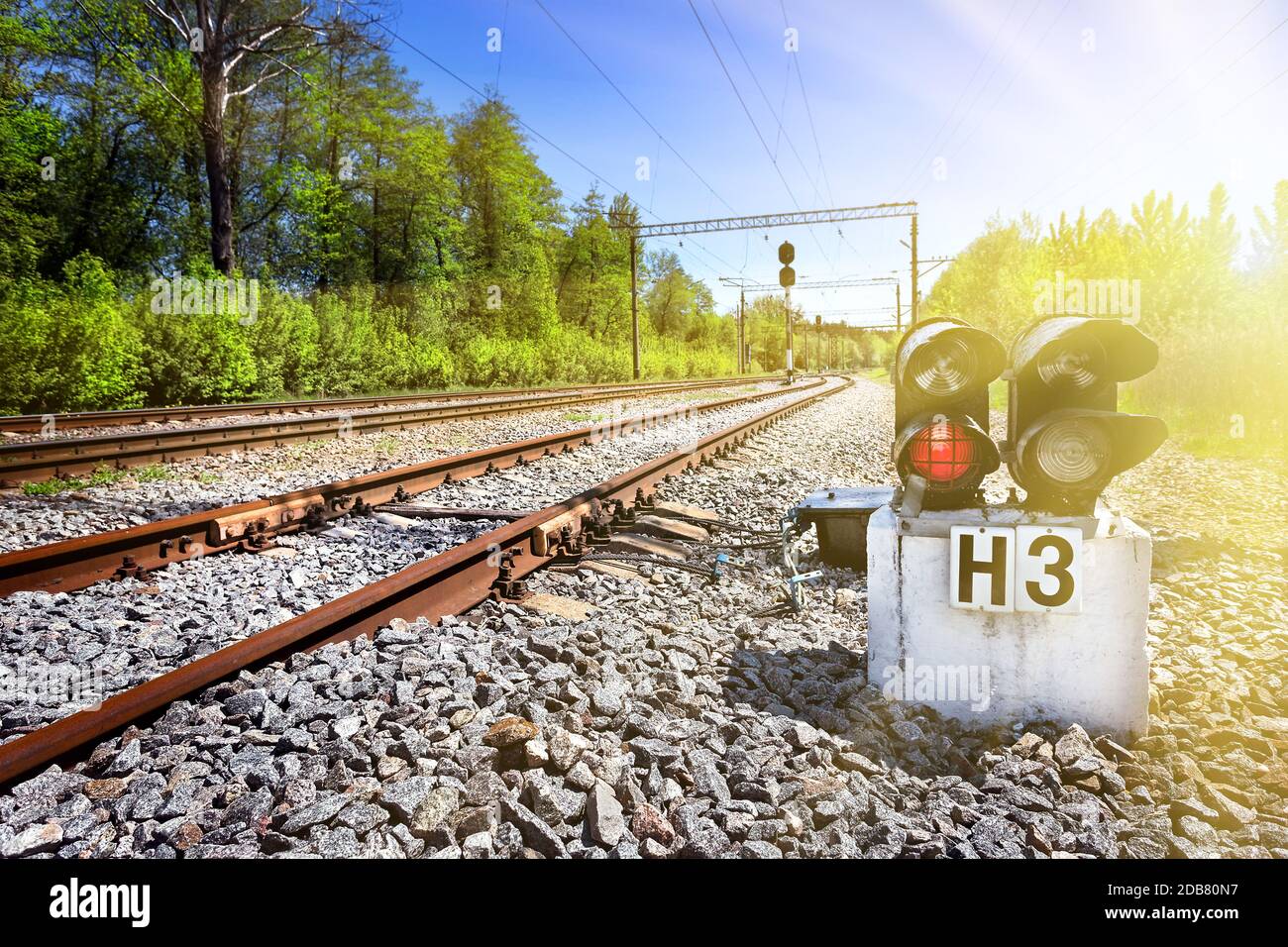 Red traffic light on a rusty abandoned railroad in the woods Stock ...