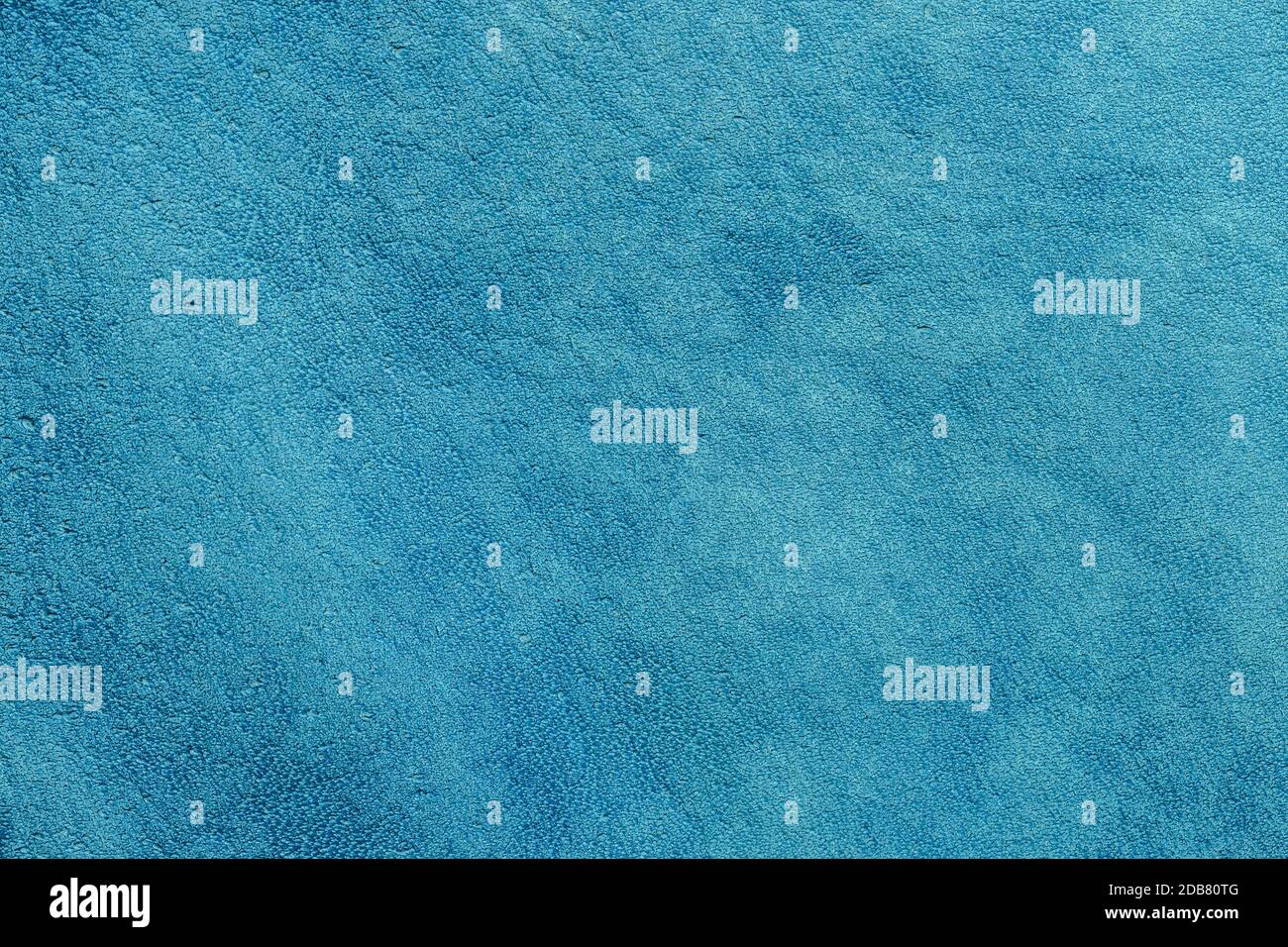 Texture of genuine leather close-up, denim blue color wall. For ...