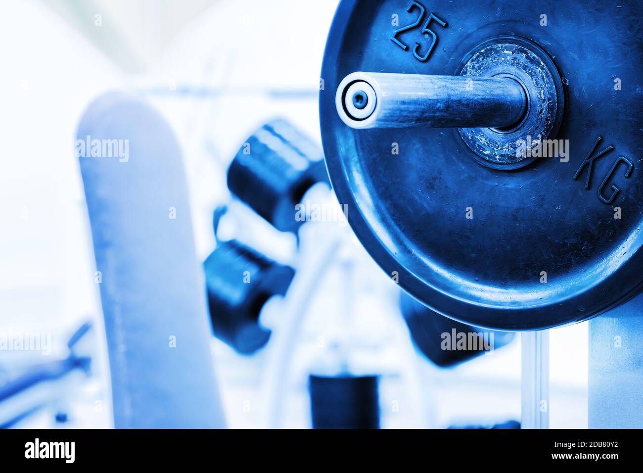 Detail barbell from bench on background of gym Stock Photo - Alamy