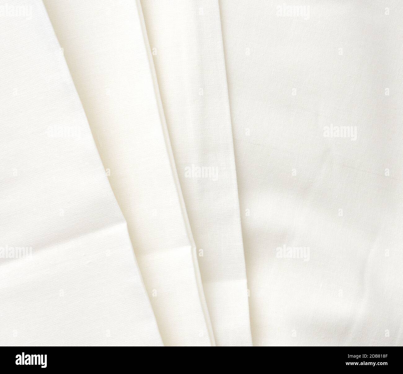 white cotton fabric folded, full frame, textile for sewing clothes and ...