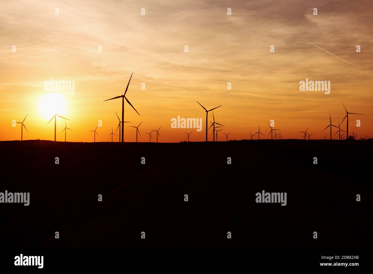 Wind Turbines Over Sunset Sky Generating Electricity. Sustainable ...