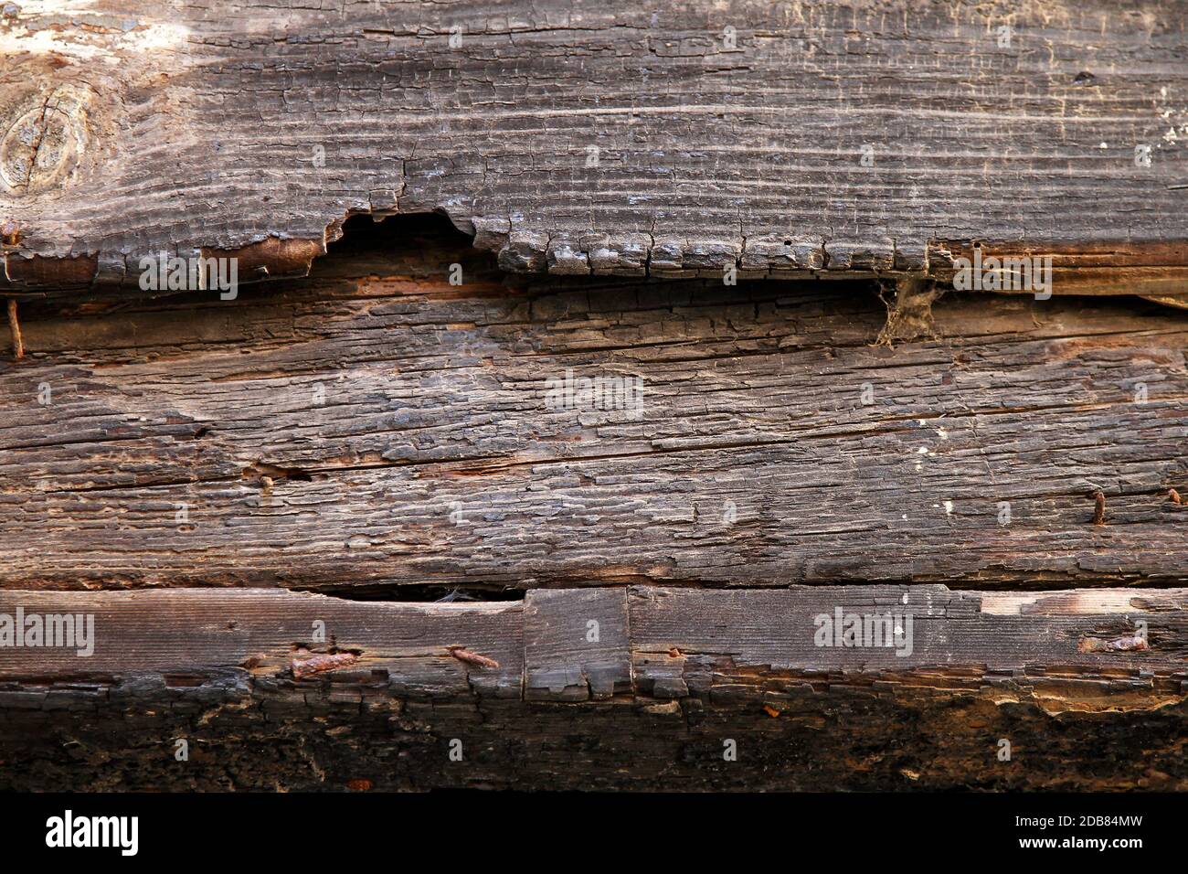 Damaged and burned wood beam after fire inferno Stock Photo - Alamy