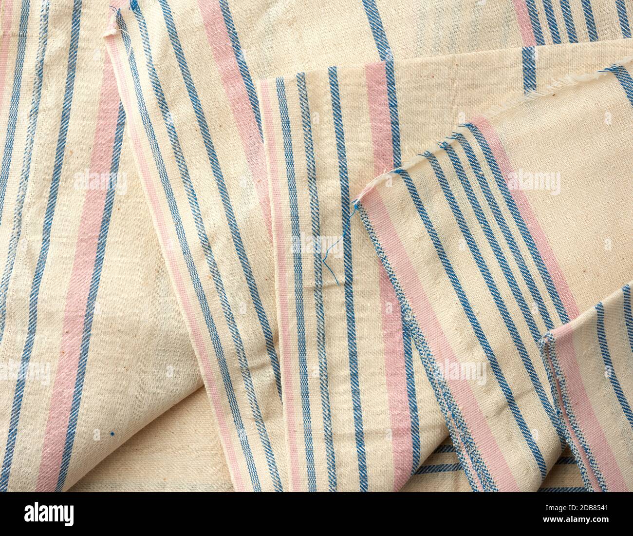 white vintage striped cotton fabric, folded canvas, close up Stock ...