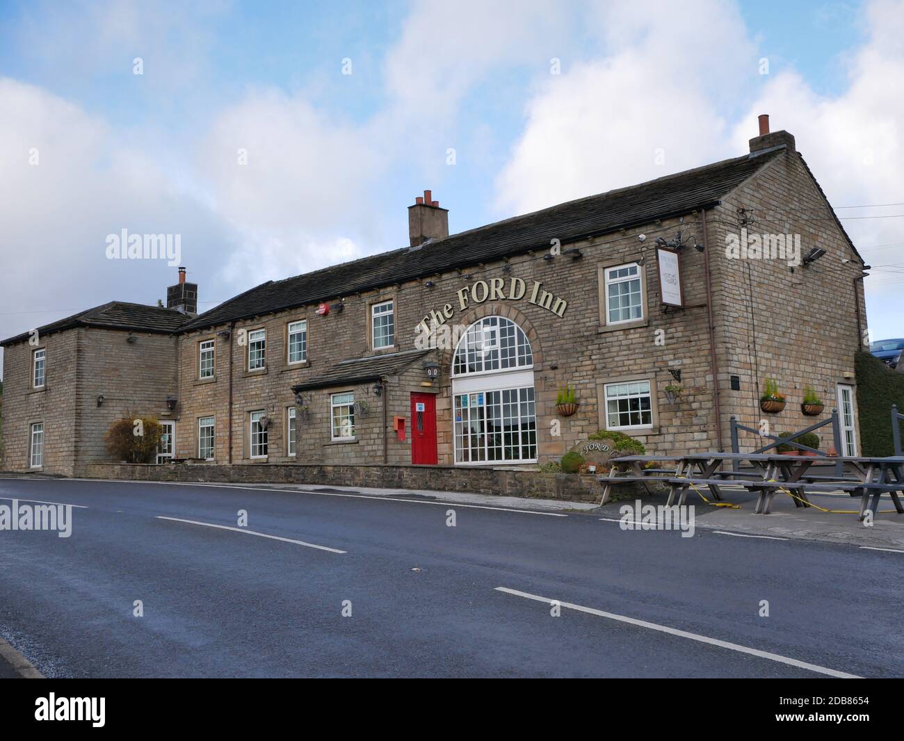 The Ford Inn roadside public house stone built large arched window red ...