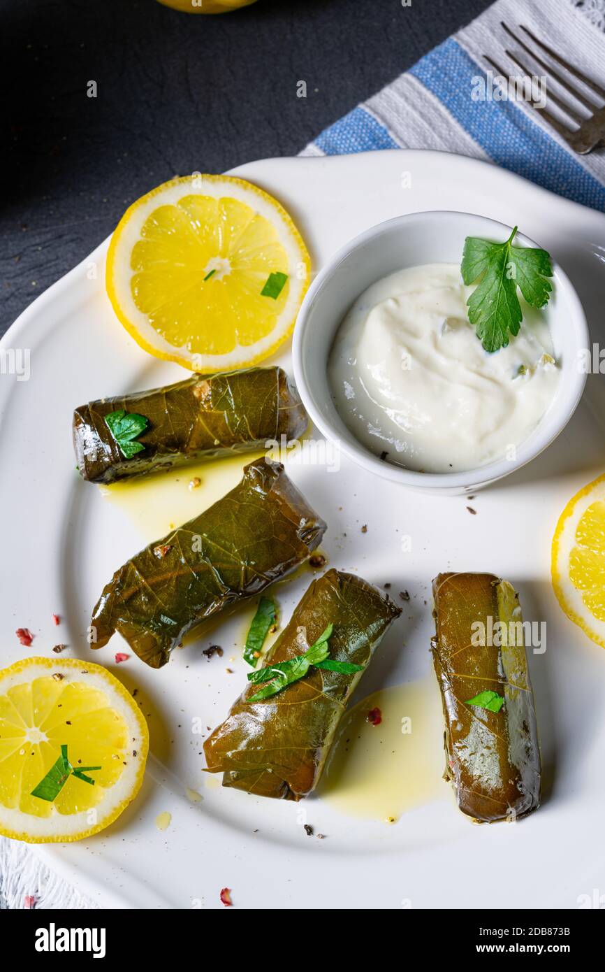 Dolmades - stuffed grape leaves the Greek way Stock Photo - Alamy