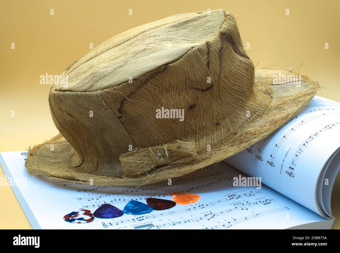 Handmade palm leaf hat isolated on neutral orange background Stock ...