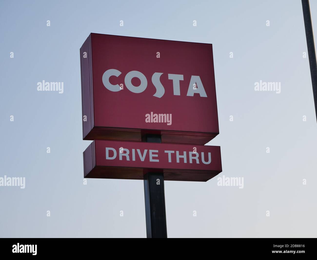 Costa drive thru red sign with white letters on black pole Stock Photo ...