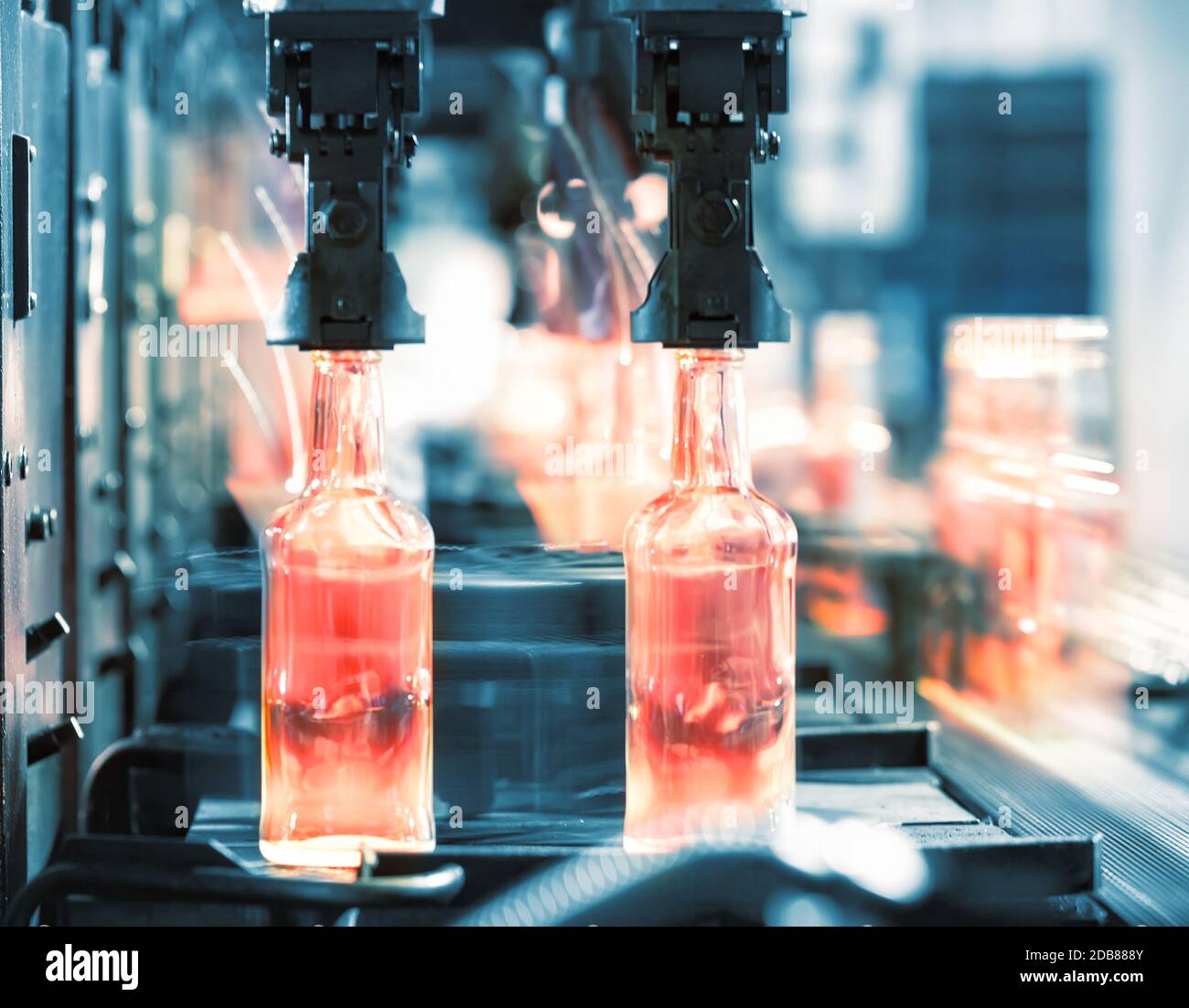 Hot glass bottles on the factory conveyor Stock Photo - Alamy