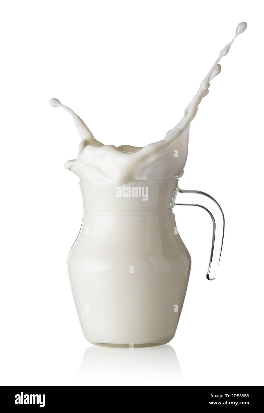 Splash in a glass decanter milk isolated on white background Stock ...