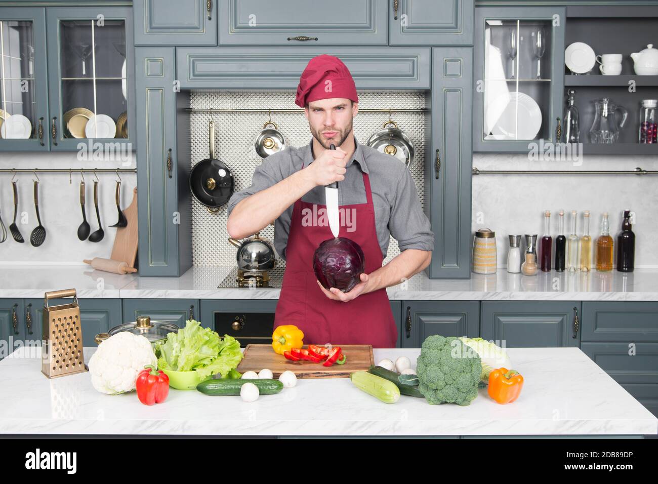 Professional cook. Chef teaches how quickly chop vegetables. Chop food ...