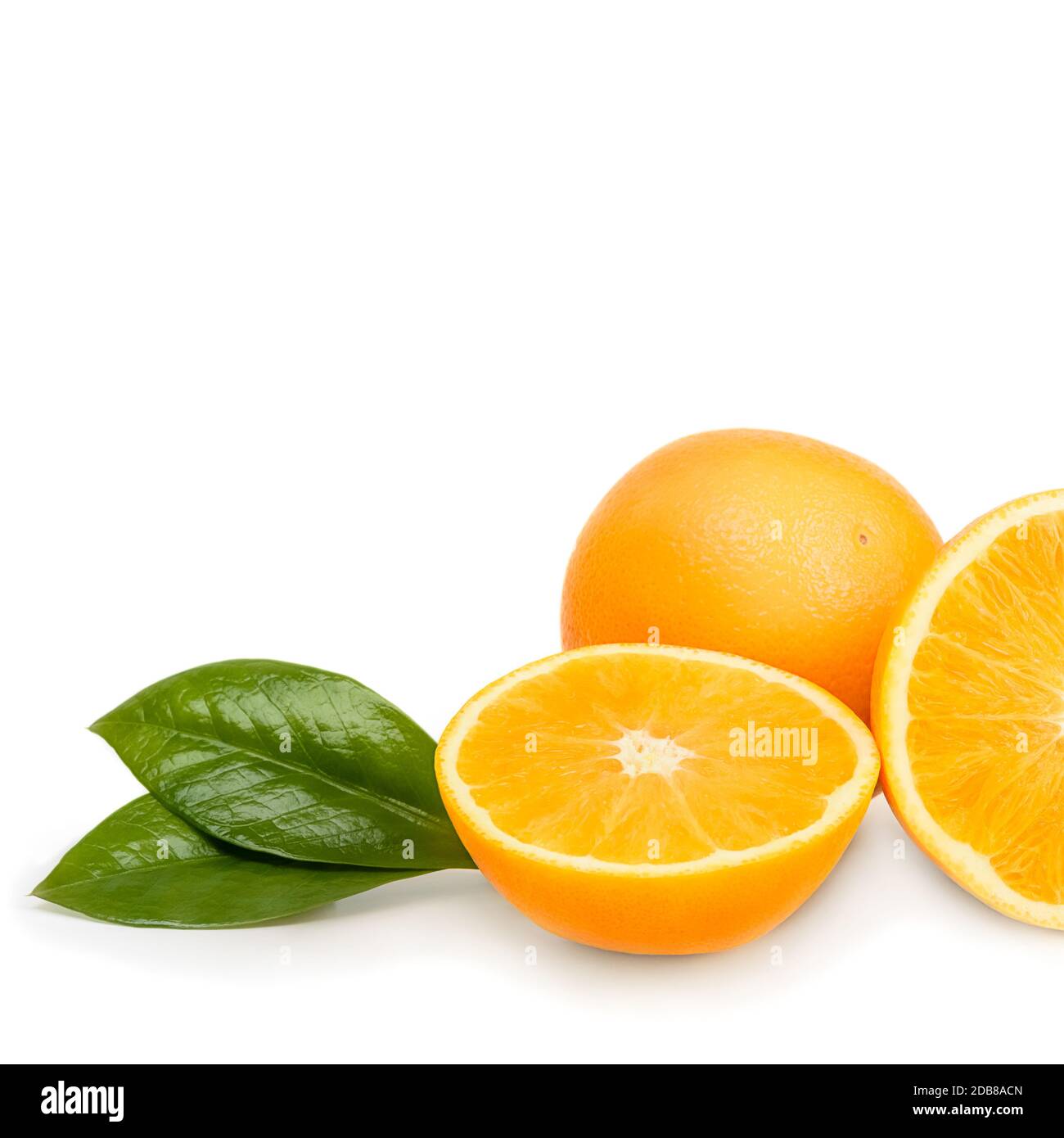 Orange whole and cut into halves with leaves. Isolated on a white ...