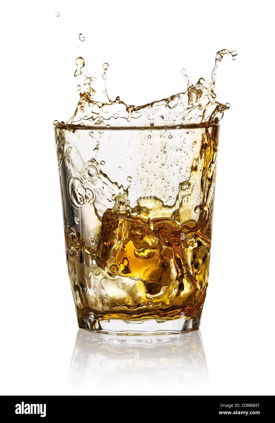 Splash in a transparent glass of whiskey isolated on white background ...