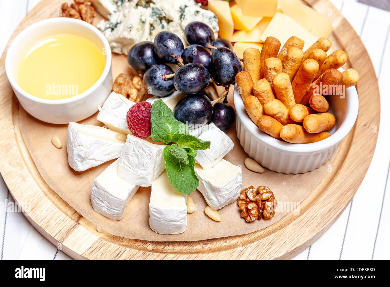 Board with different types of cheese. Cheeses mix set dor blu chedar ...