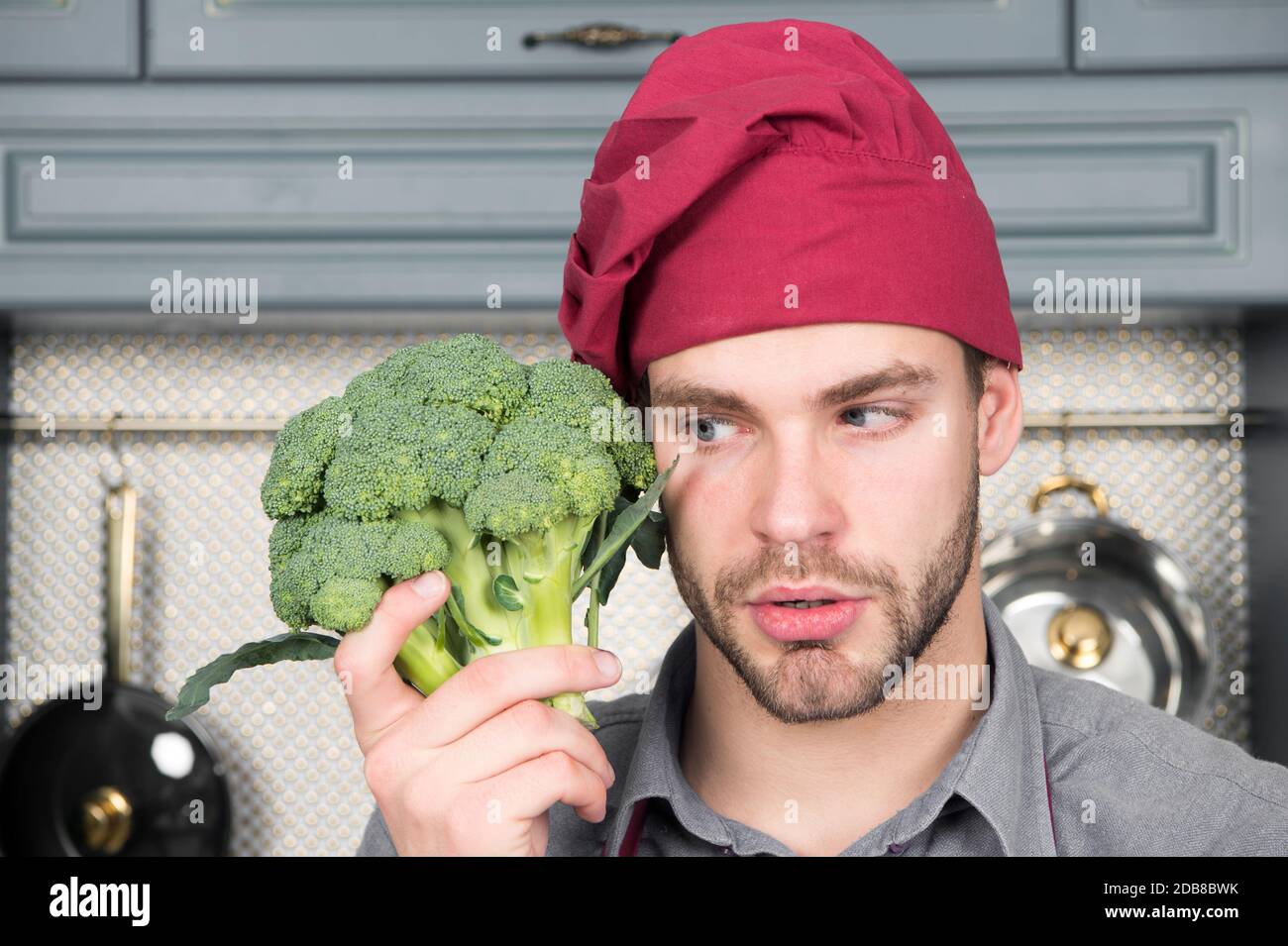 How to cook broccoli. Man hold organic broccoli. Man ready to cook ...