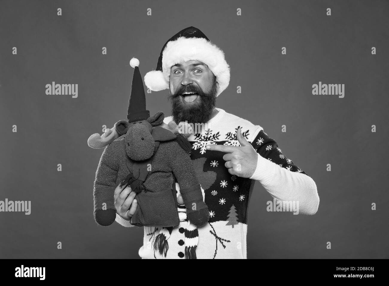 Santa Claus Ive been good. Santa point finger at reindeer toy. Happy ...