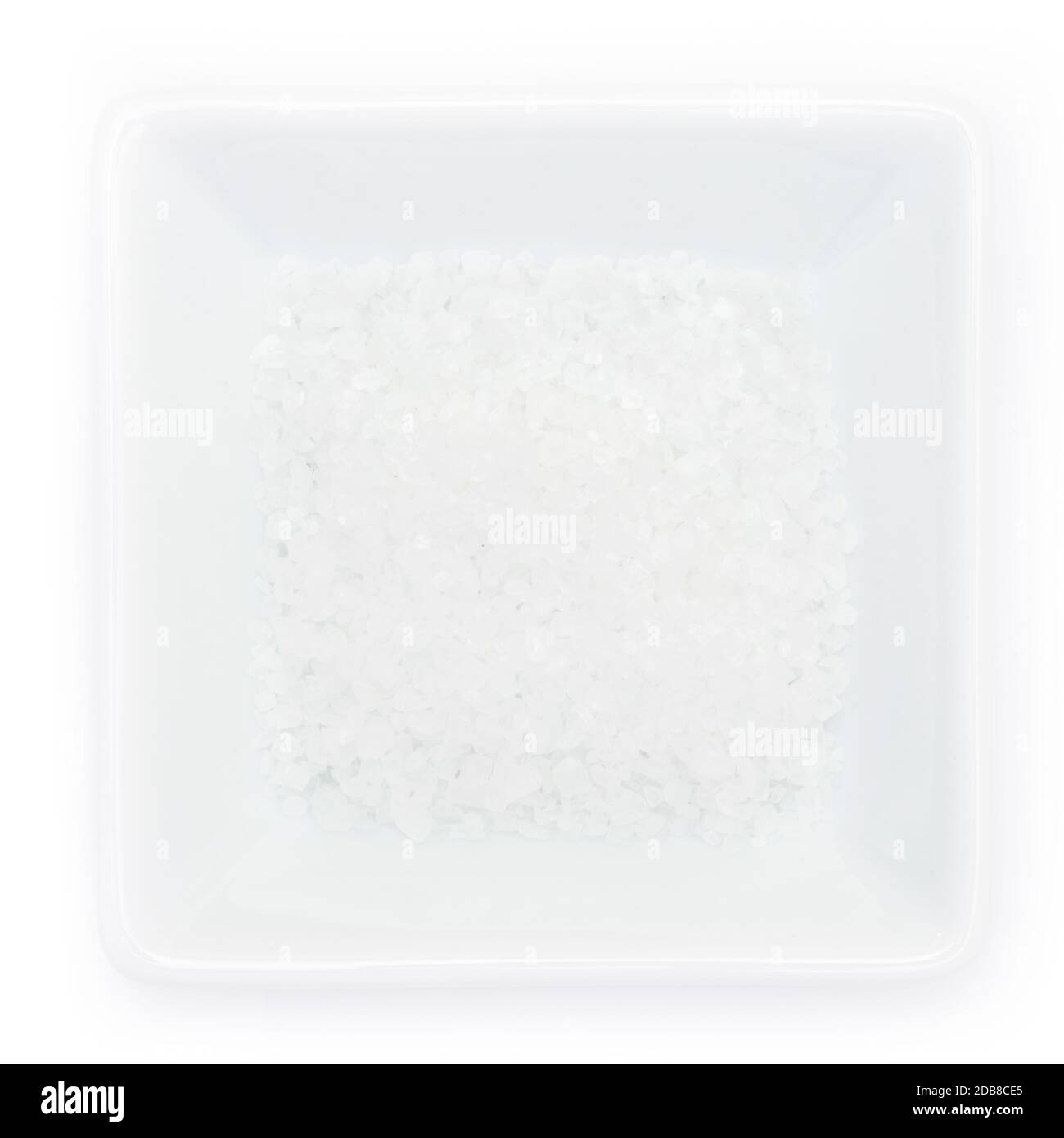 Rough sea salt in a white bowl in top view Stock Photo - Alamy