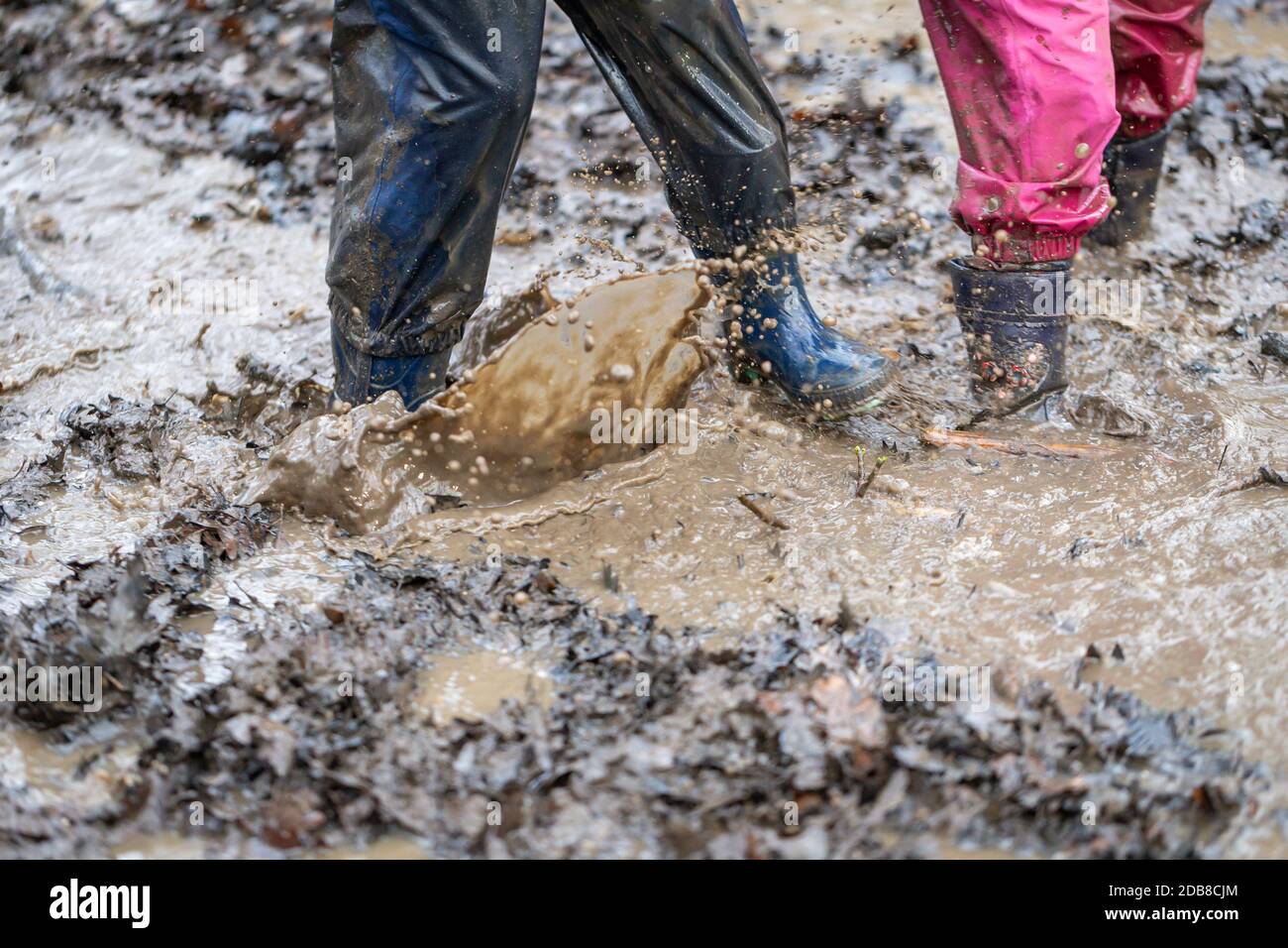 Kid Jumping In A Mud Puddle High Resolution Stock Photography and ...