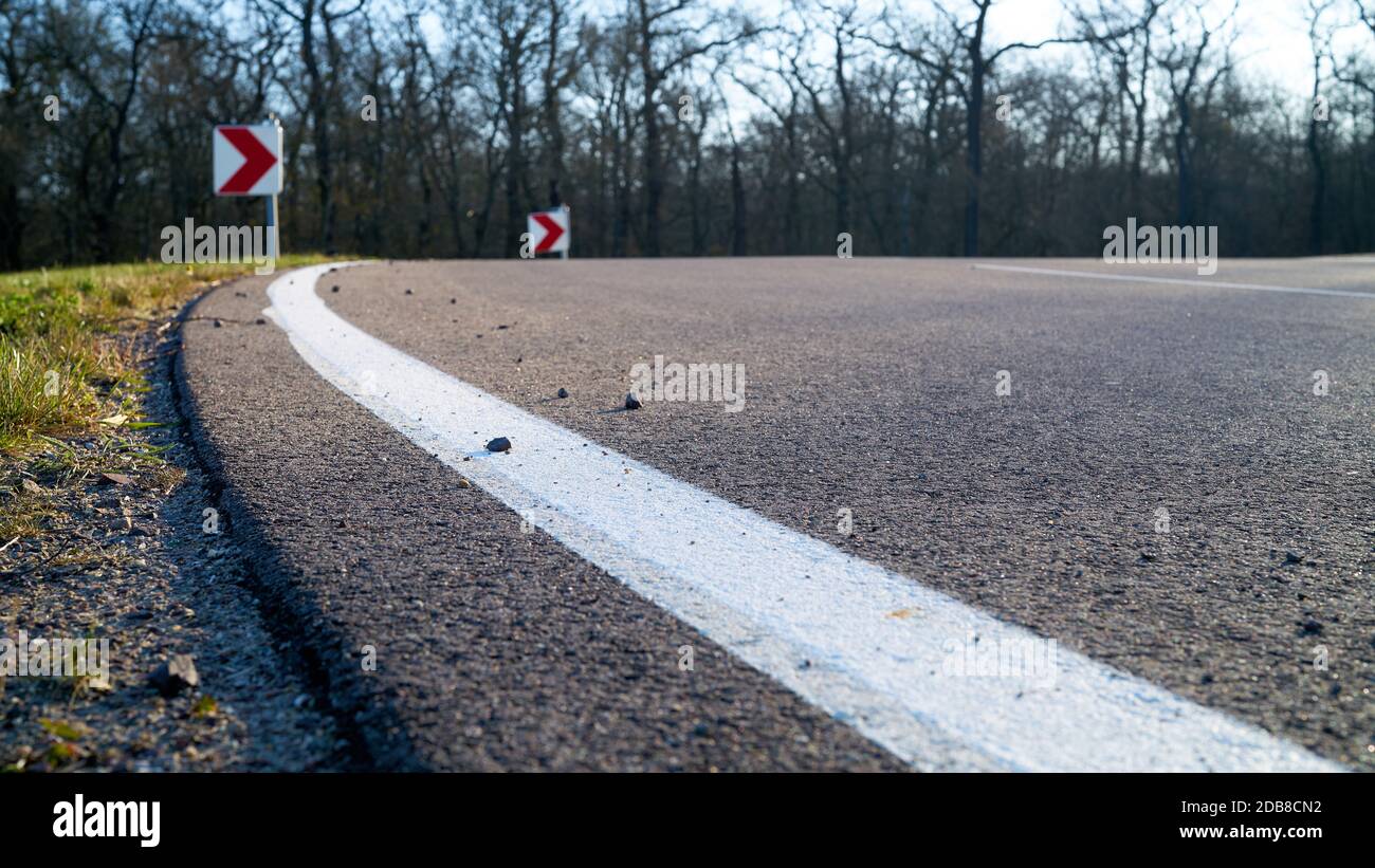 Right turn of an asphalt road with lane marking Stock Photo - Alamy
