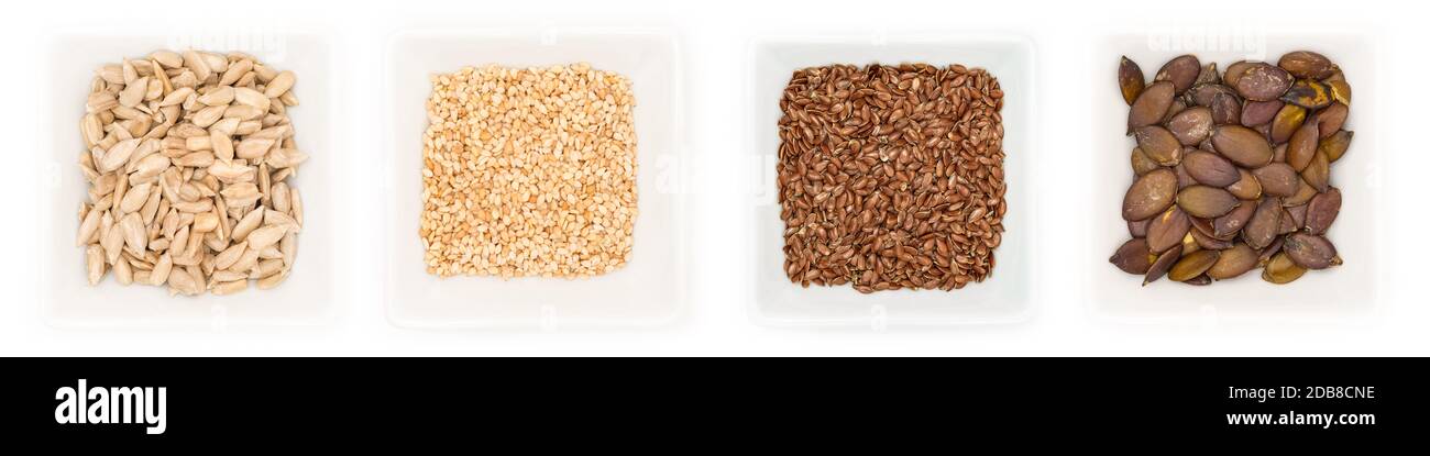 Collection of different edible seeds in white bowls in top view Stock ...