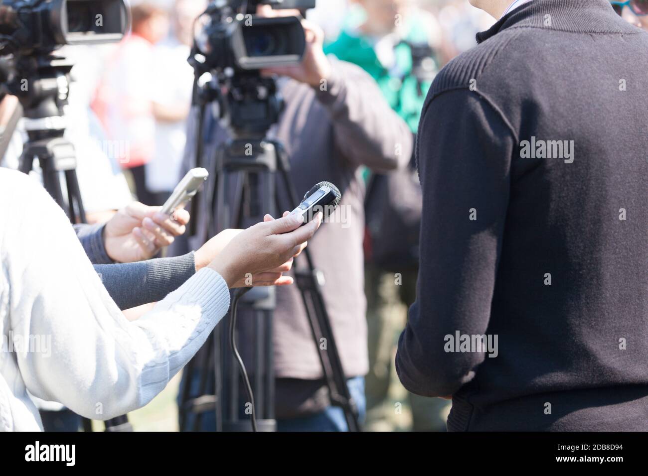 News conference. Filming an media event with a video camera Stock Photo ...