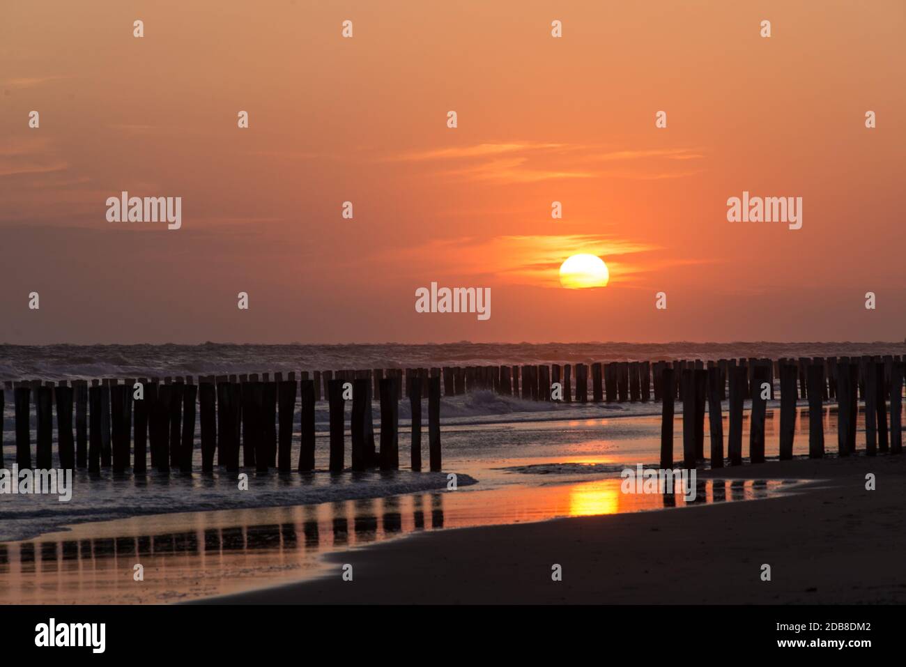 Wave breaks at sunset at Zoutelande beach on the Walcheren peninsula ...