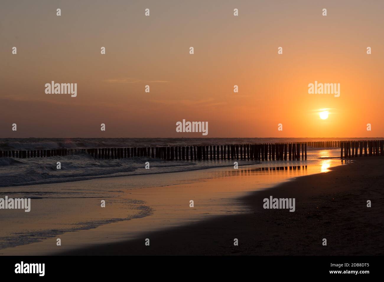 Wave breaks at sunset at Zoutelande beach on the Walcheren peninsula ...