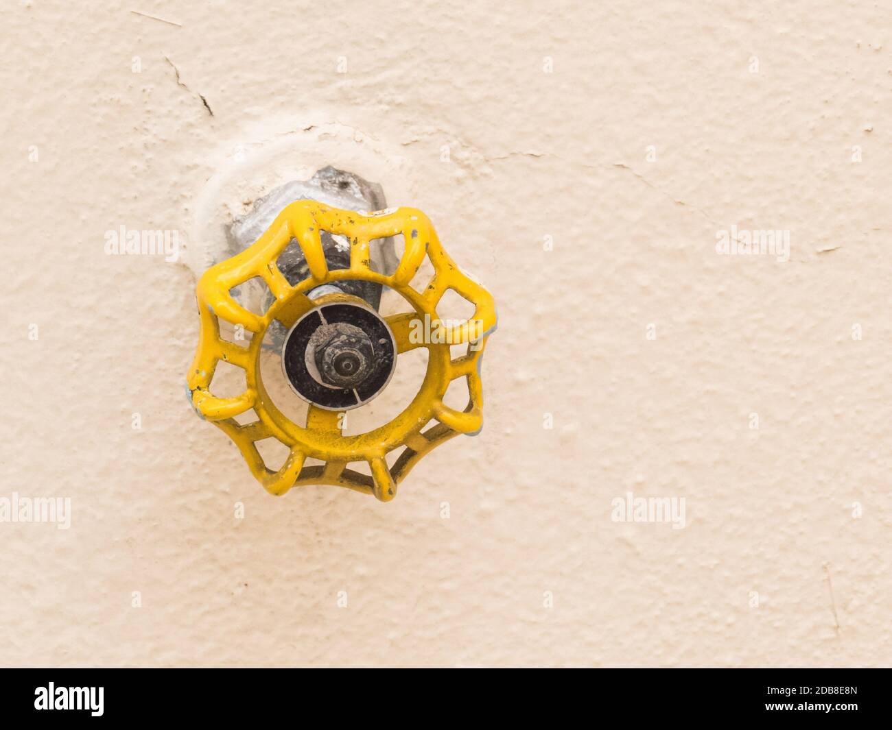 Yellow tap isolated on light background.Hydraulic valve Stock Photo - Alamy