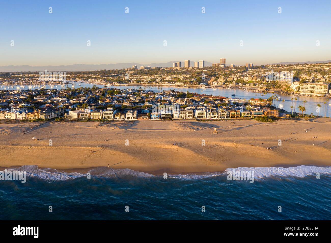 View of a beach on the Balboa Peninsula with the Newport Beach harbor ...